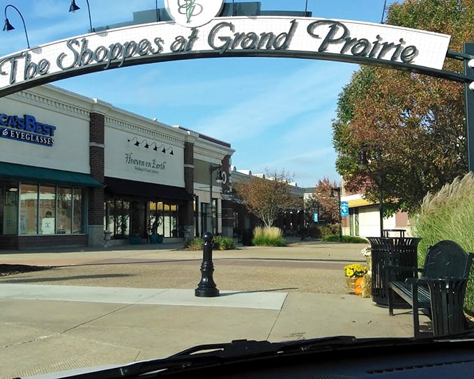 The charming archway at The Shoppes at Grand Prairie creates a welcoming entrance to Peoria's premier shopping destination.