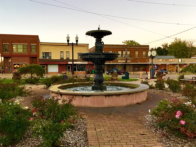 Woodstock's fountain becomes the heart of community life, surrounded by timeless brick architecture.