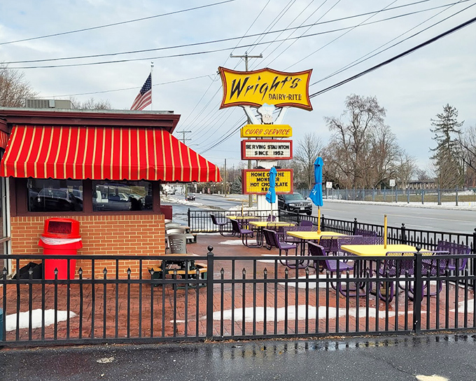 Bright yellow signage and outdoor seating transport you straight back to the golden age of drive-ins.