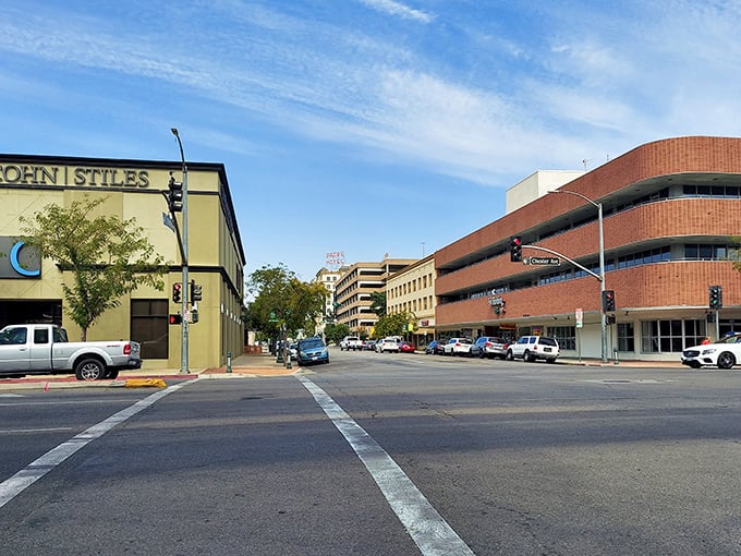 Downtown Bakersfield's architectural jazz—brick curves and straight edges playing together under a sky that's bluer than a Willie Nelson classic.