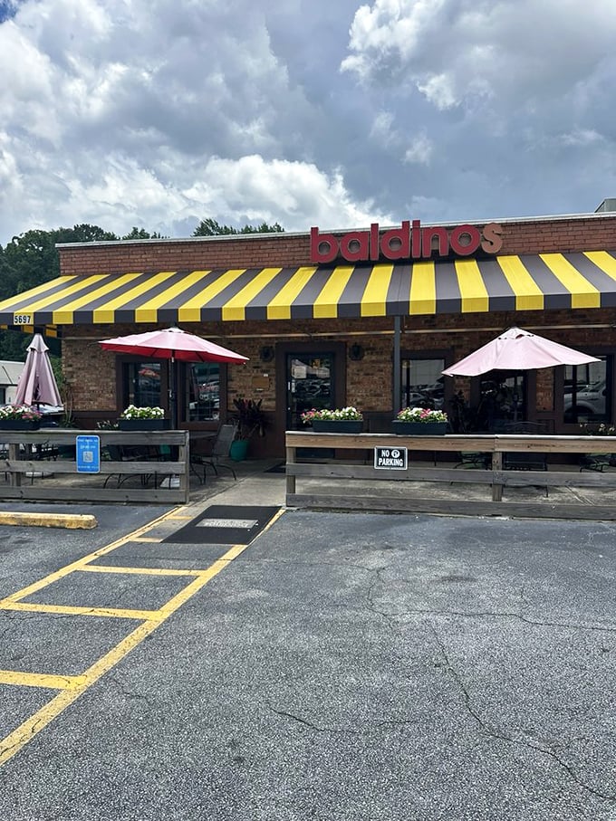 The cheerful awning looks like it was borrowed from a 1950s ice cream parlor! Baldinos combines brick, sunshine, and sandwich magic – a recipe for happiness on any cloudy day.