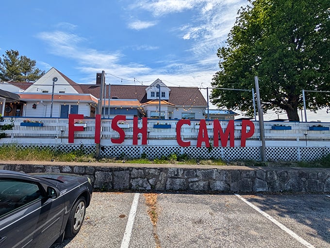 The "FISH CAMP" sign doesn't lie – this waterfront spot delivers lakeside dining with maritime charm to spare.