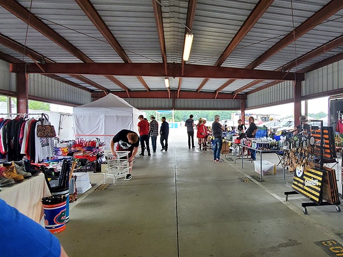 Vendor booths stretch endlessly under protective roofing, creating a shopper's paradise rain or shine.