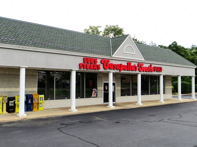 That classic storefront design whispers promises of authentic flavors just steps from the sandy shore.