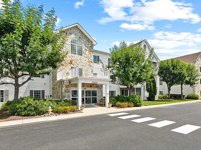 Another angle of Cedar Bay's elegant entrance, where retirement dreams come with a side of coastal charm.