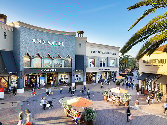 Walking through Citadel Outlets feels like stepping onto a movie set. Those palm trees aren't just for show—they're keeping your shopping bags shaded!