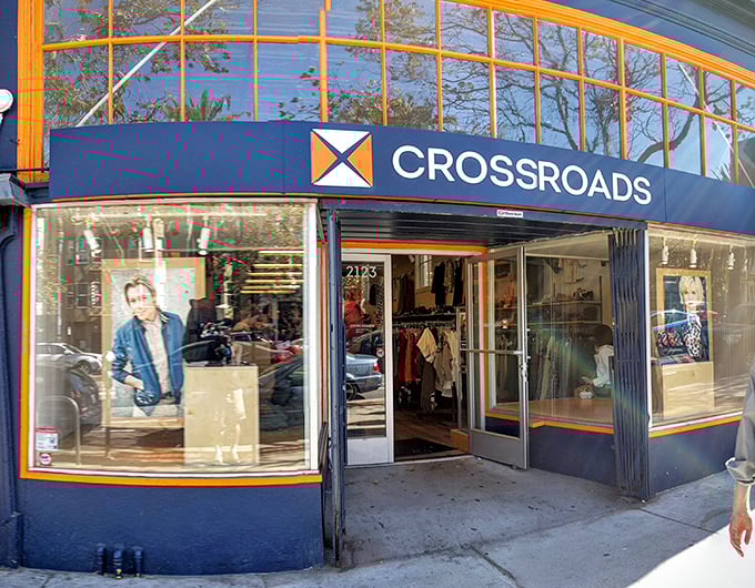 Large windows showcase curated fashion finds at Crossroads Trading, where secondhand shopping feels like a boutique experience.
