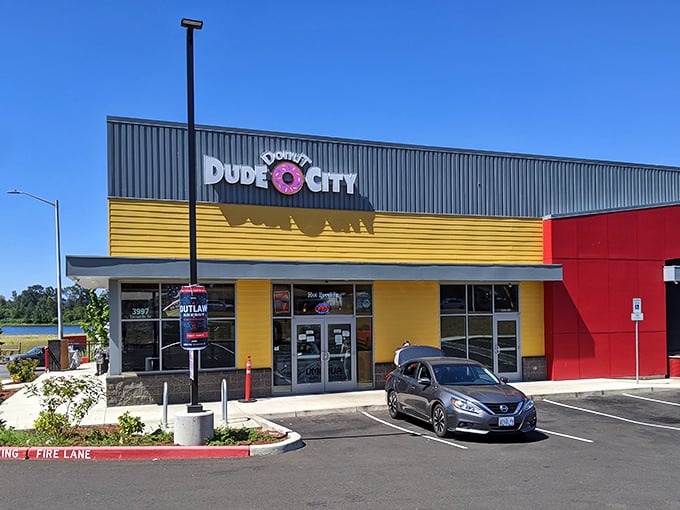 With its sunny yellow facade and playful pink donut logo, Dude Donut City stands out like a beacon of sweetness against Oregon's often gray skies.