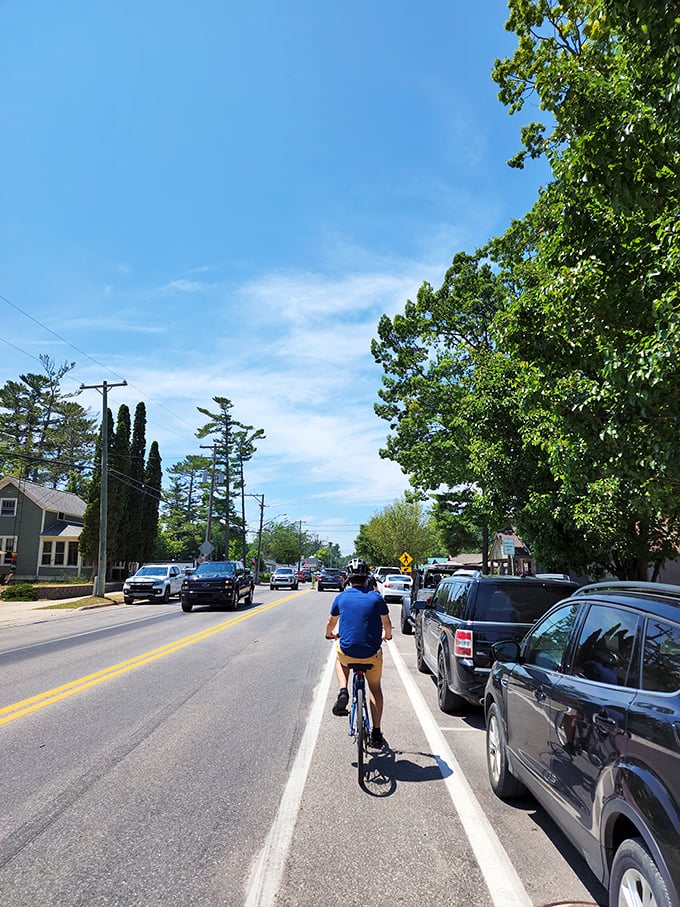 Biking through Glen Arbor feels like pedaling through a postcard that someone forgot to mail to paradise.