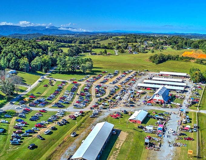 That aerial view shows serious business – acres of cars mean folks drive from everywhere for these deals.