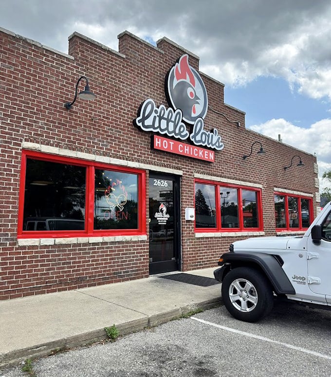 Those red-trimmed windows are like warning signs: "Caution – seriously addictive hot chicken inside this unassuming brick building."