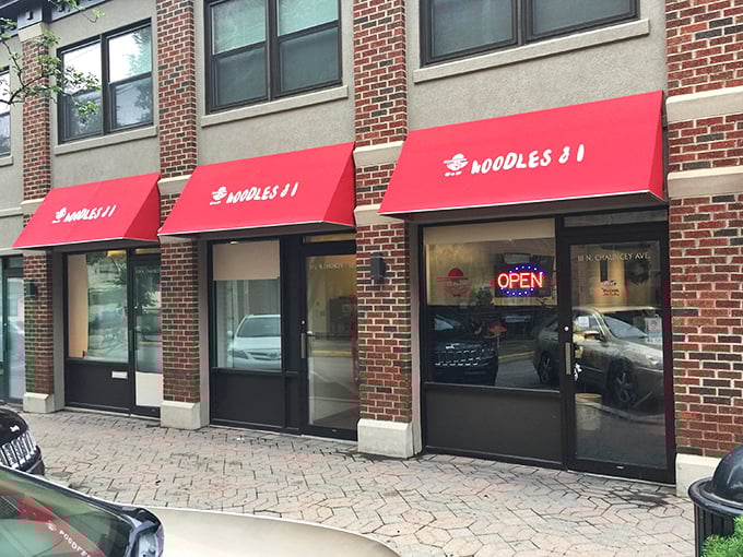 That bright red awning is like a beacon for anyone craving authentic comfort food in the heart of campus country.