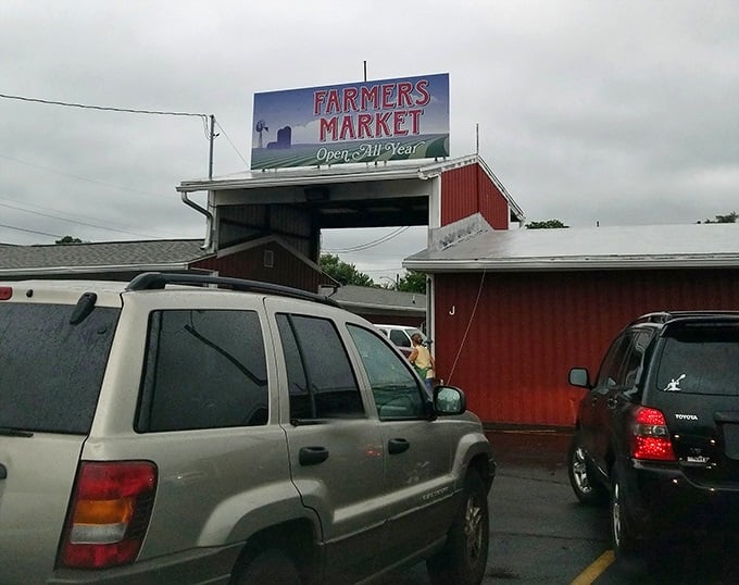 South Bend's red barn market welcomes visitors through its gates – a cathedral of fresh finds and vintage treasures.