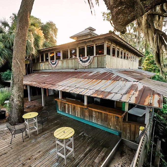 This weathered wooden deck at Sunbury isn't just a restaurant – it's a front-row seat to coastal Georgia's natural beauty.
