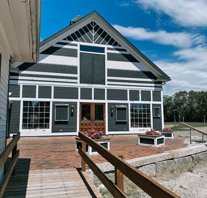Sunlight plays across The Blessing Barn's distinctive facade – a thrifter's country retreat with purpose and charm.