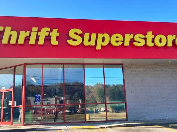 Thrift Superstore's bright red trim frames a window to bargain paradise. The name doesn't lie—it's super in every way.