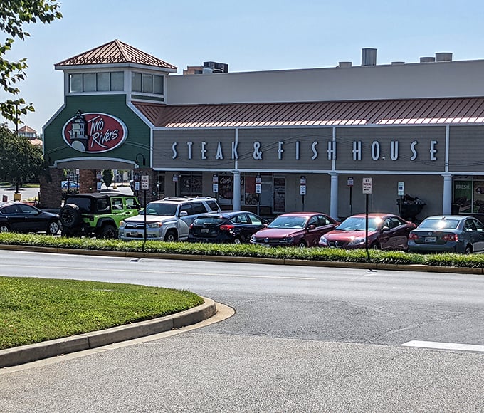 The modern exterior of Two Rivers houses a Maryland institution where steaks and seafood compete for the spotlight—and everyone wins.