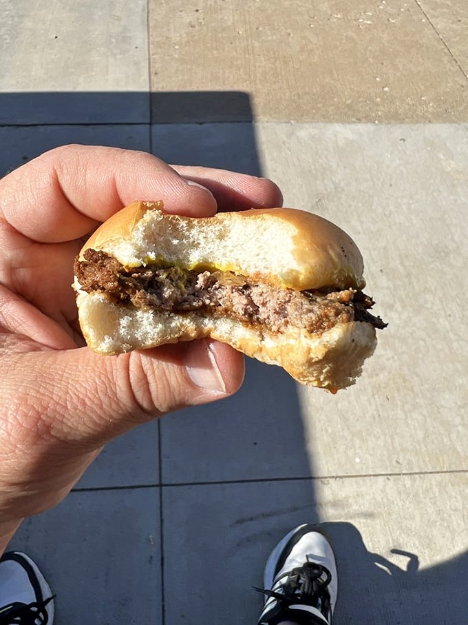 One bite tells the story better than words ever could—this is what happens when tradition and beef meet on a tiny bun.