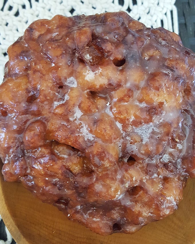 This apple fritter isn't just fried dough—it's a masterpiece of caramelized chunks of apple wrapped in glazed, crispy goodness.