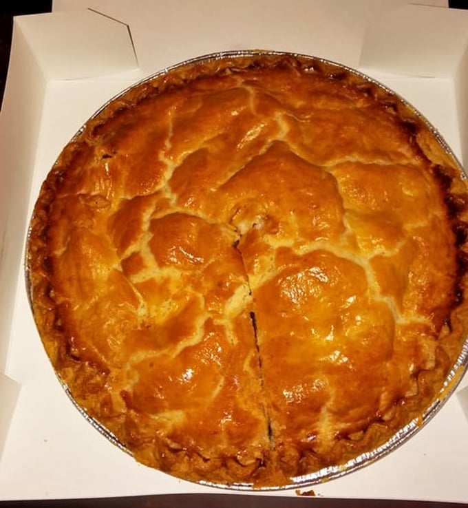 This golden-topped apple pie isn't just dessert—it's an American tradition encased in a flaky, buttery time machine.