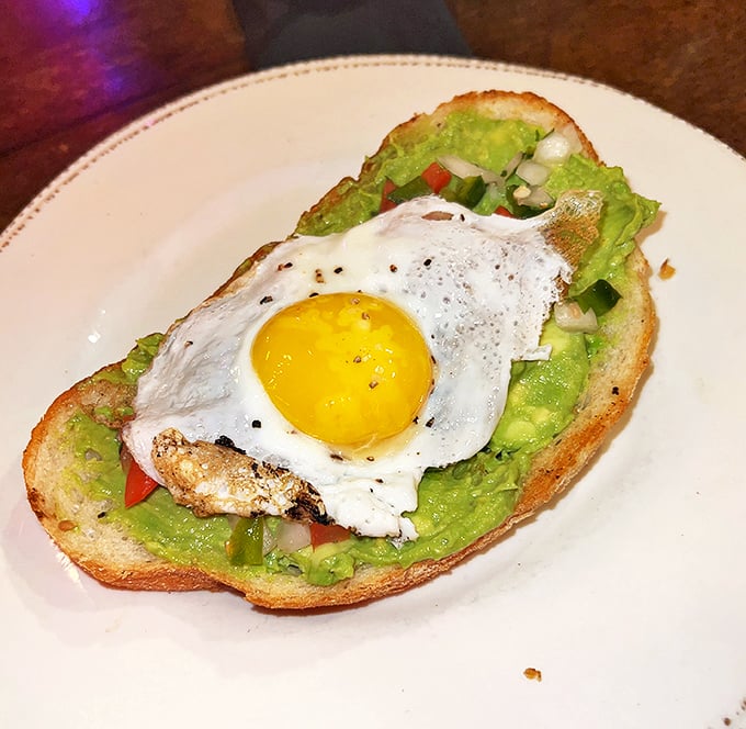 Avocado toast gets the Nashville treatment with a perfectly sunny-side-up egg perched atop vibrant green goodness—healthy-ish never looked so tempting.