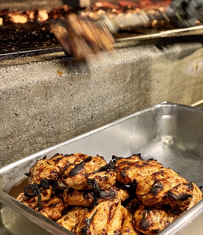 Where smoke meets fire meets chicken. The blackened edges aren't mistakes—they're flavor bookmarks in a meaty novel.