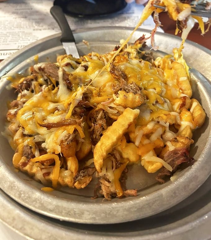 When French fries meet BBQ and cheese, it's not a guilty pleasure—it's just good sense. The kind of dish that demands to be shared.