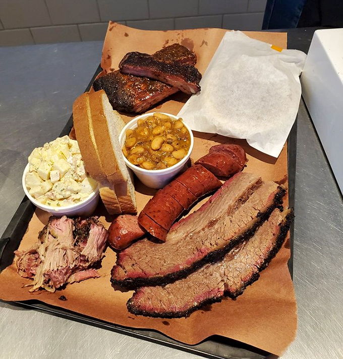 When your tray arrives loaded with multiple meats, sides, and bread, it's like Christmas morning – if Santa smoked brisket instead of delivering toys.