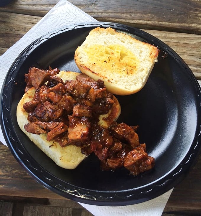 BBQ that doesn't hide behind fancy presentation – just gloriously saucy meat on a bun that's ready to transport you to Texas flavor heaven.