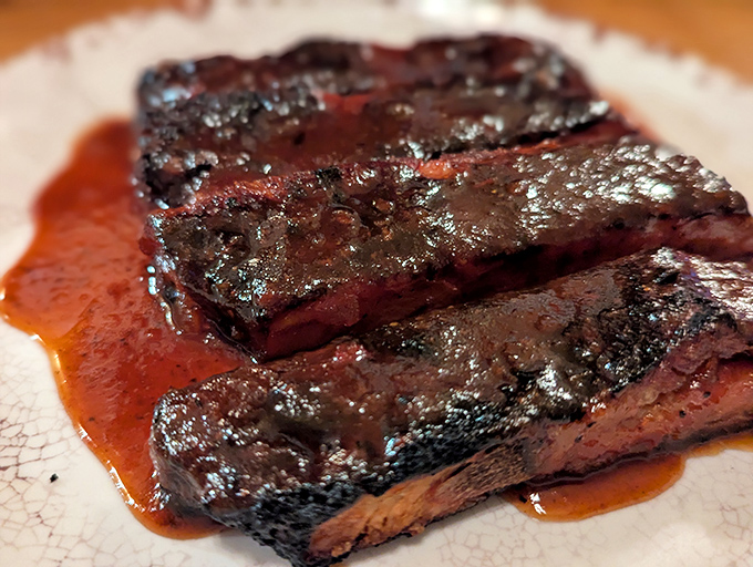 Glistening ribs bathed in sauce that's traveled the perfect distance between sweet and tangy – resistance is futile.