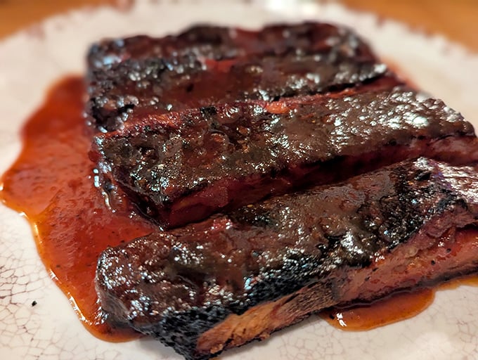 Glistening ribs bathed in sauce that's traveled the perfect distance between sweet and tangy – resistance is futile.