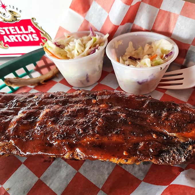 BBQ ribs that don't just fall off the bone – they practically leap into your mouth with smoky, saucy enthusiasm.