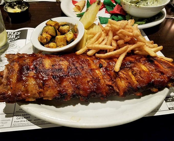 These baby back ribs don't need a jingle—they speak the universal language of "get-in-my-belly-now" with their glistening, sauce-lacquered perfection.