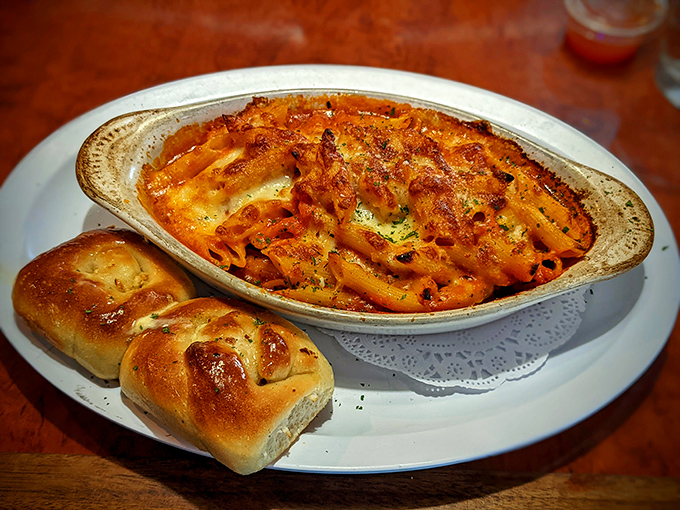 Baked ziti that bubbles with promise, the cheese achieving that perfect golden-brown crust that makes you want to call dibs.