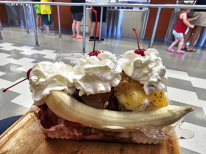 Behold the banana split in its natural habitat—a gravity-defying monument to excess that somehow makes perfect sense.