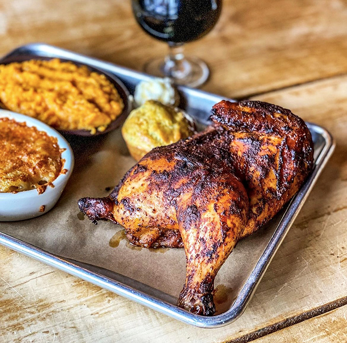 When barbecue chicken achieves this level of smoke-kissed perfection, with sides that refuse to be overshadowed, you know you've found culinary nirvana.
