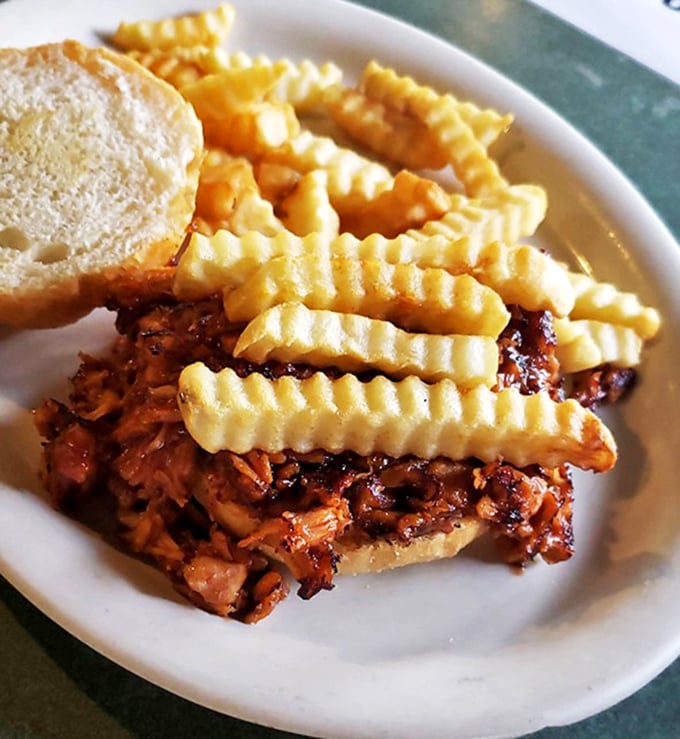 BBQ chicken sandwich with crinkle-cut fries—proof that sometimes the simplest combinations make for the most satisfying meals.