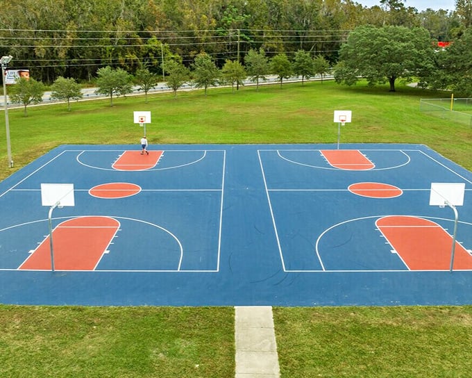 These basketball courts aren't just for recreation—they're community gathering spots where generations connect through the universal language of sport.