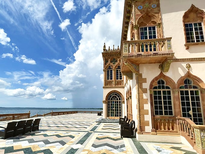 The bayfront terrace offers geometric perfection against Sarasota's endless horizon—where mathematical precision meets Florida's wild natural beauty.