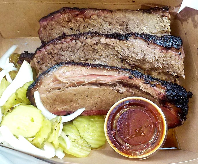 Brisket so perfectly smoked it should have its own Instagram account. That pink smoke ring deserves its own championship belt.