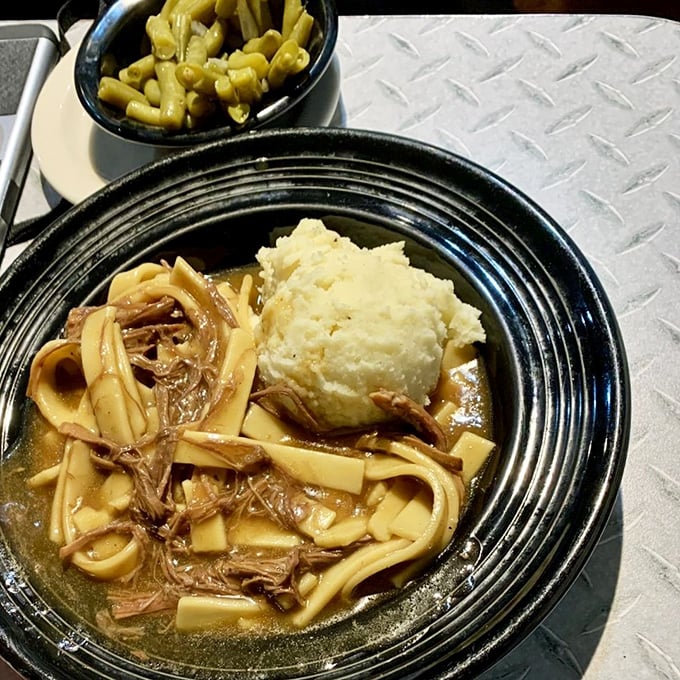 Beef and noodles with a cloud of mashed potatoes – the kind of meal that makes you understand why your grandparents never needed therapy.