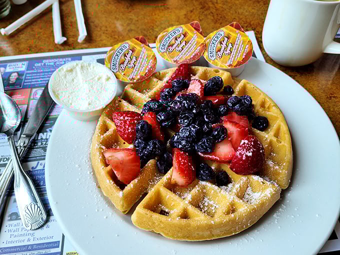 This Belgian waffle, crowned with fresh berries and dusted with powdered sugar, transforms breakfast into an occasion worth celebrating.