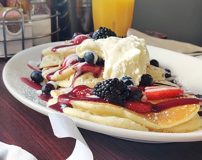 Berry pancakes that look like they belong on a magazine cover – the whipped cream melting into a pool of breakfast bliss.