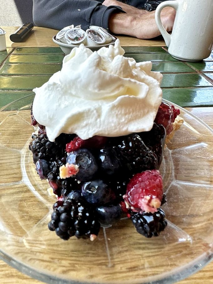 Berry pie topped with whipped cream—where fruit and pastry meet in perfect harmony, creating what might be Oregon's most photogenic dessert.