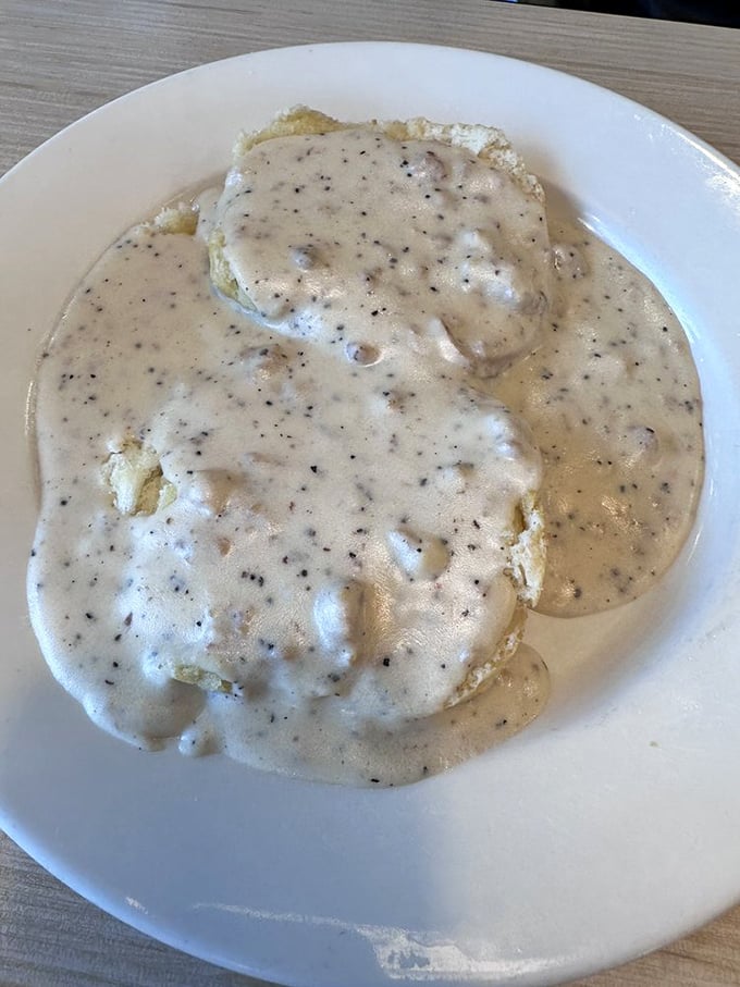 Biscuits swimming in pepper-flecked sausage gravy—a breakfast so comforting it should come with a pillow for the inevitable food coma.