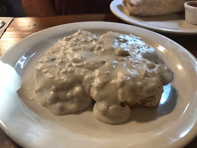 Biscuits swimming in creamy gravy—the kind of dish that makes you want to hug the cook and cancel your afternoon plans.