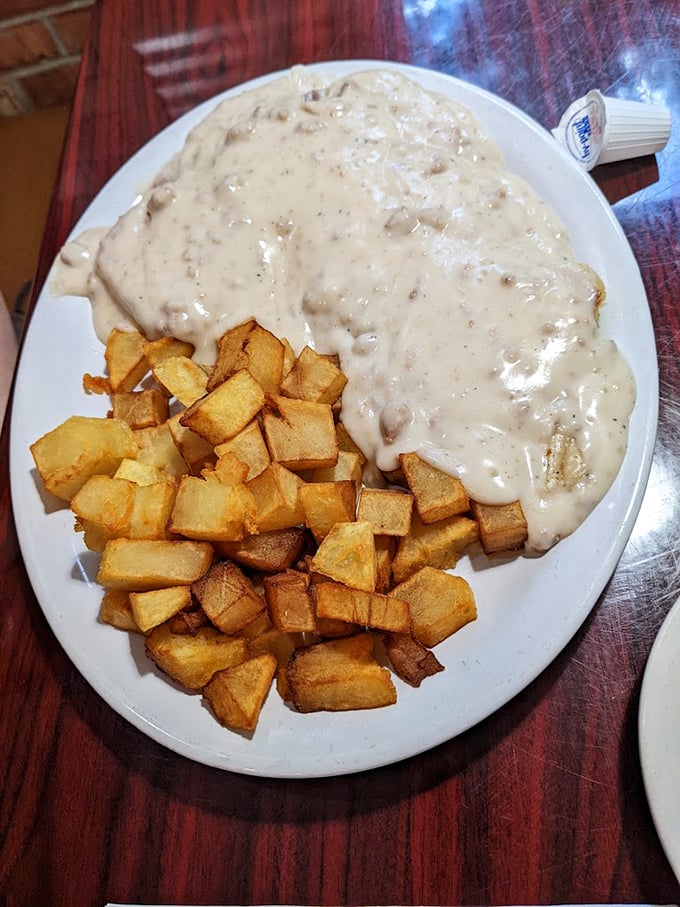 Biscuits and gravy—the Southern comfort that makes you forget about cholesterol counts while the home fries stand by as willing accomplices.