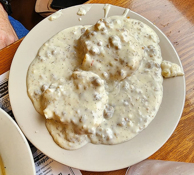 Biscuits and gravy—the edible security blanket of the Midwest. This plate contains more comfort than an entire season of "The Great British Baking Show." 
