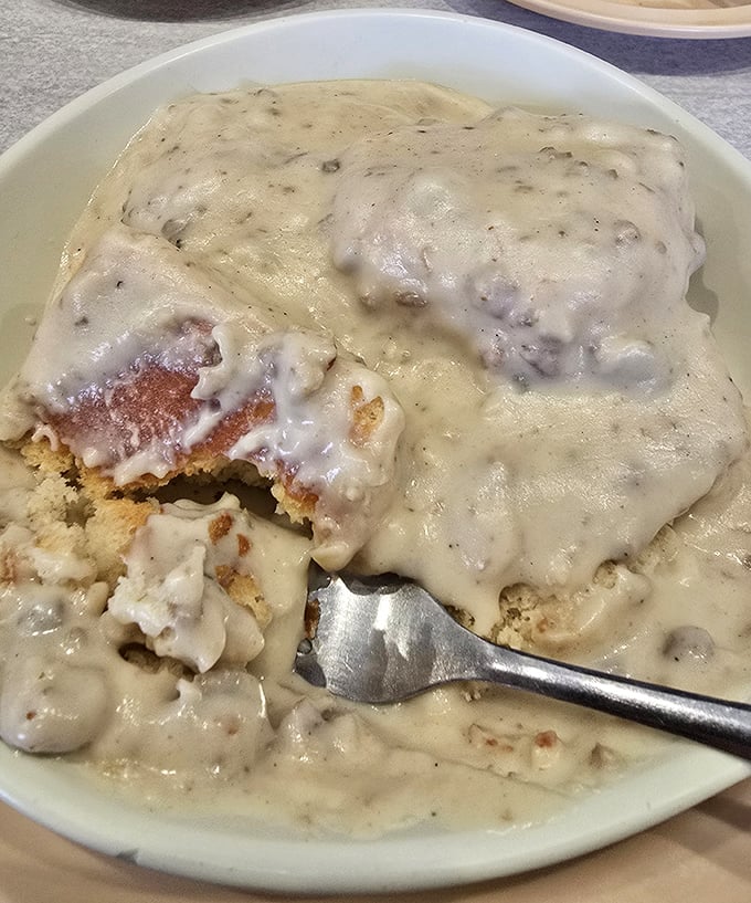 Biscuits drowning happily in a sea of peppery gravy – the breakfast equivalent of a warm hug from your favorite grandparent.