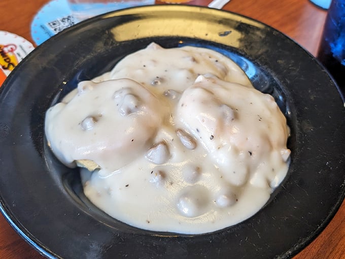 Biscuits swimming in creamy gravy—the breakfast equivalent of a warm hug from your grandmother, if your grandmother was an exceptional Southern cook.